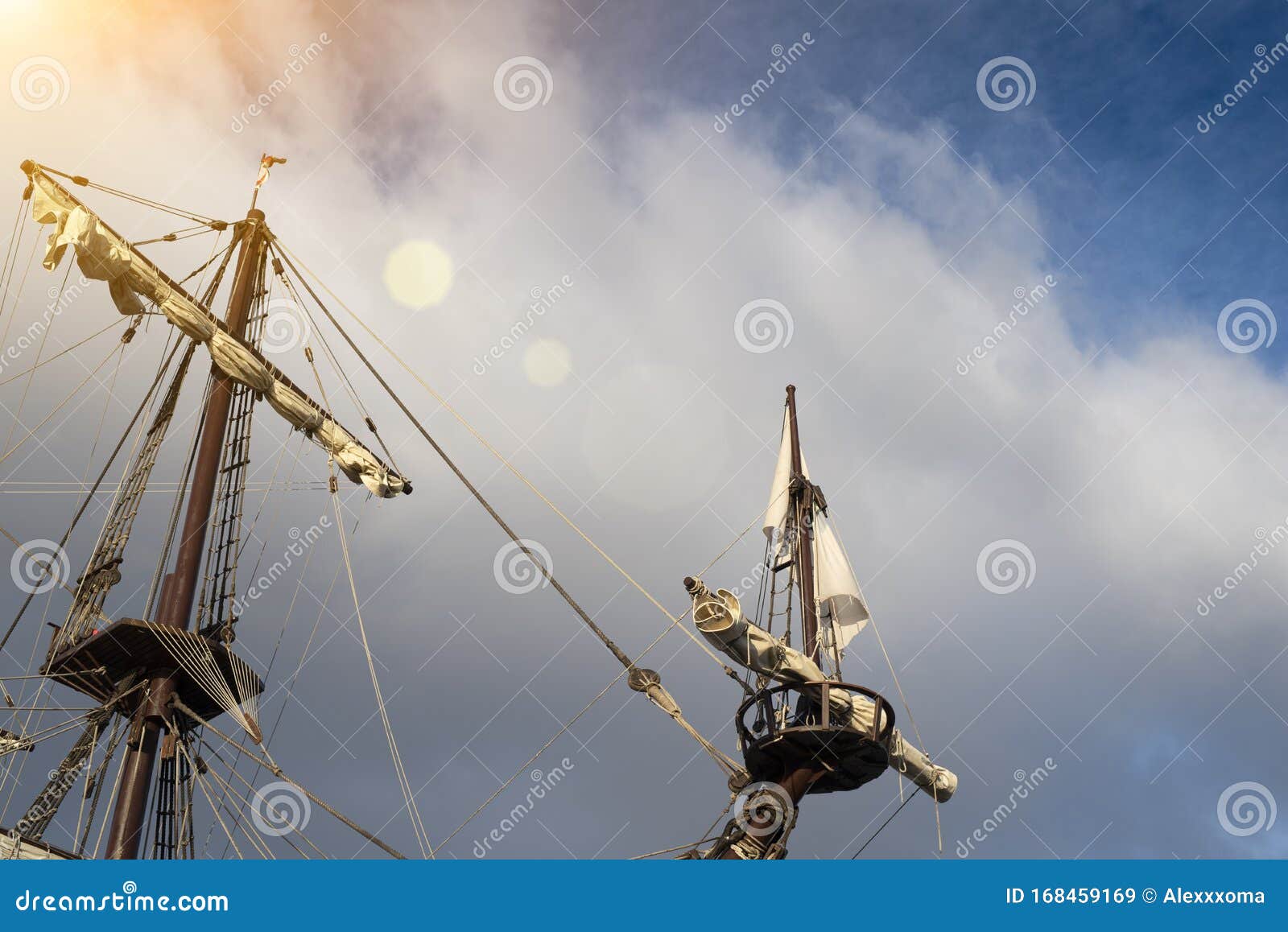 Masts and Rigging of Old Pirate Ship on Background of Cloudy Blue Sky ...