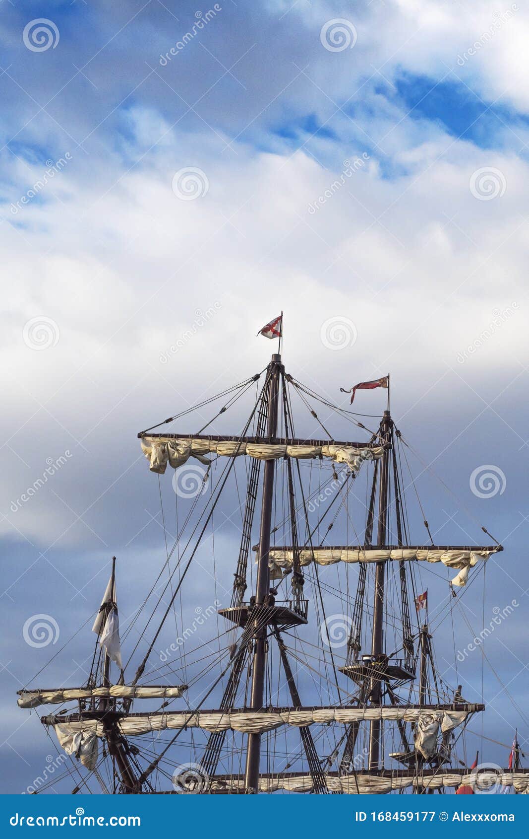 Masts and Rigging of Old Pirate Ship on Background of Cloudy Blue Sky ...
