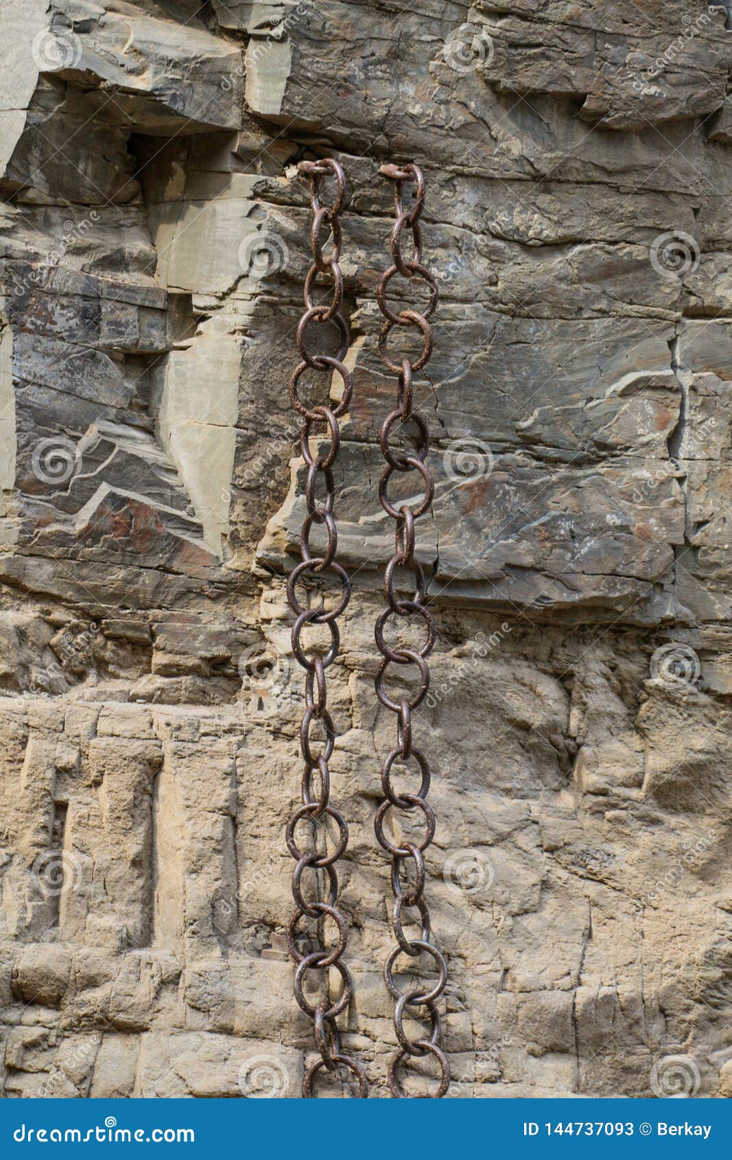 Matal Chains Pairs Hanging by the Side of a Rock Side Stock Image ...