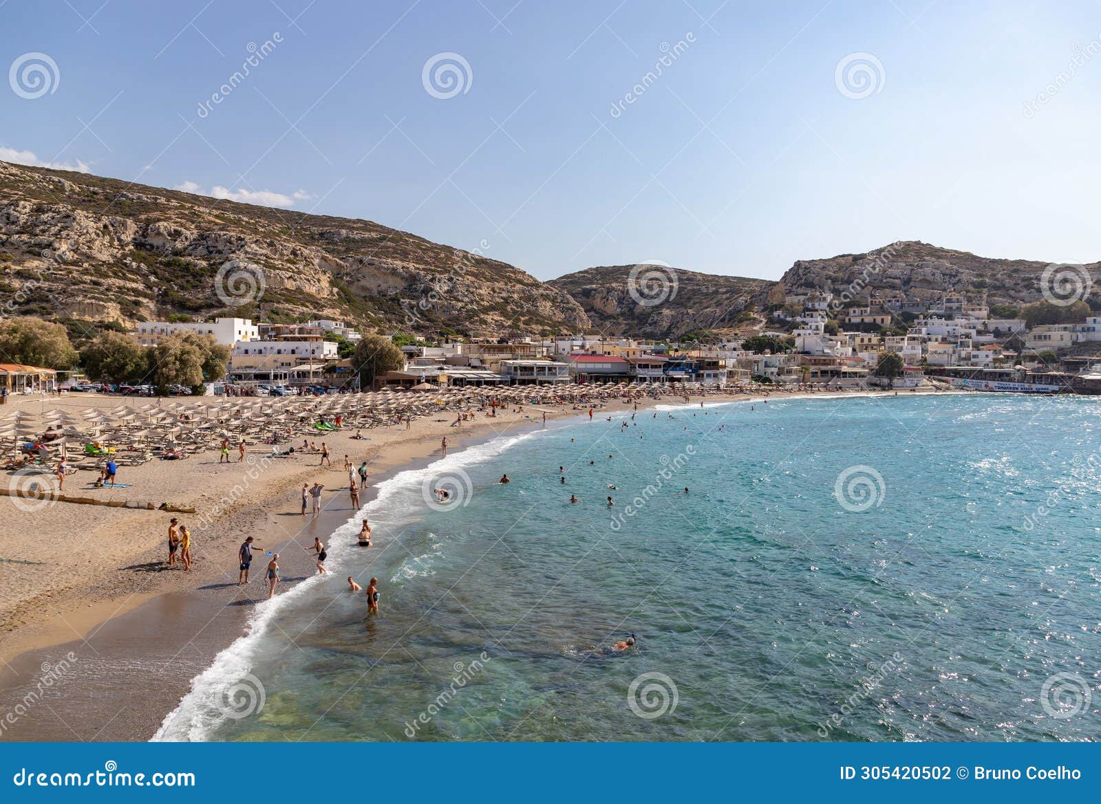 Matala Beach stock photo. Image of sunshades, landmark - 305420502