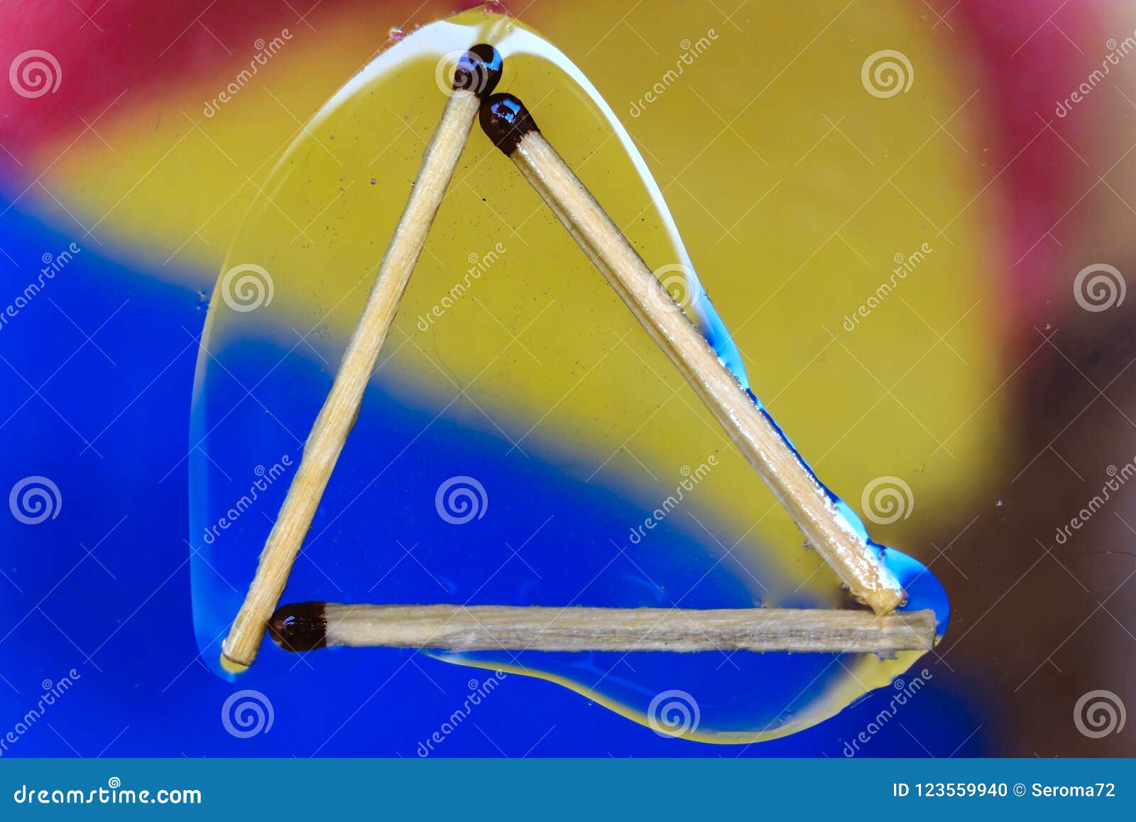 Match in a Colorful Background of Water and Oil Drops Stock Photo ...