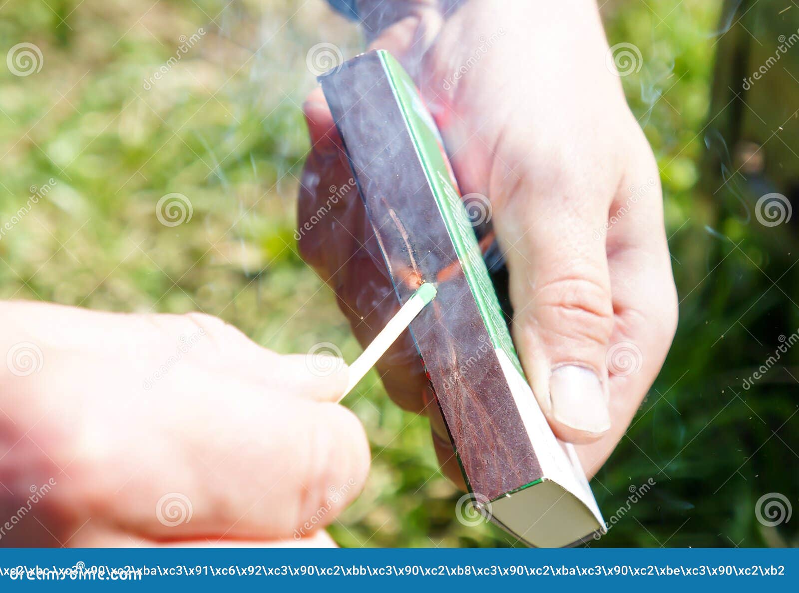Match during Ignition, a Man Lights a Match for a Bonfire on Boxes ...