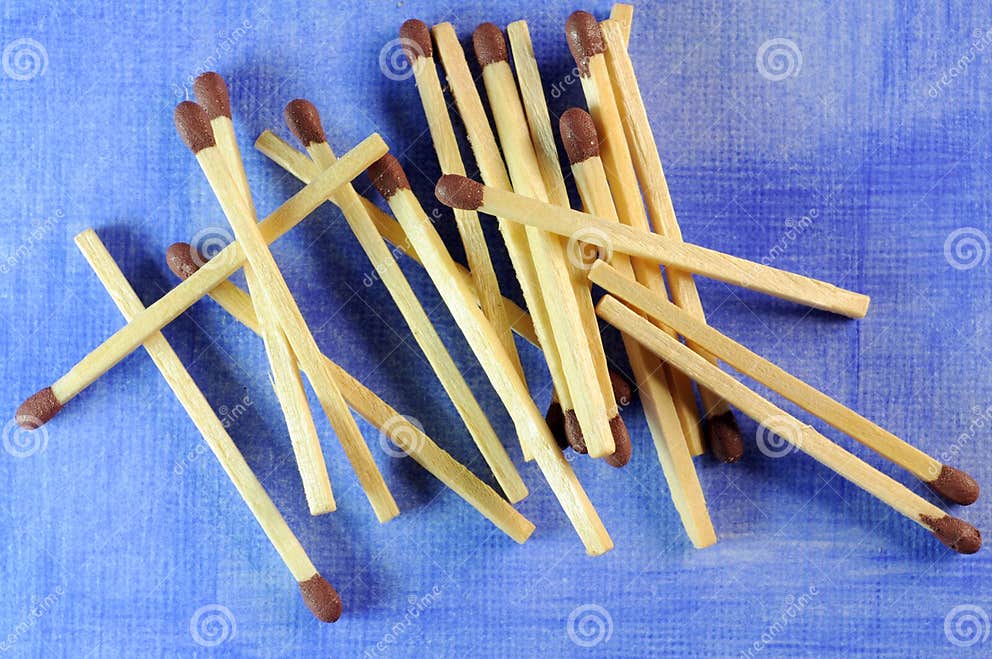 Matches on blue stock image. Image of brown, burning - 29065659
