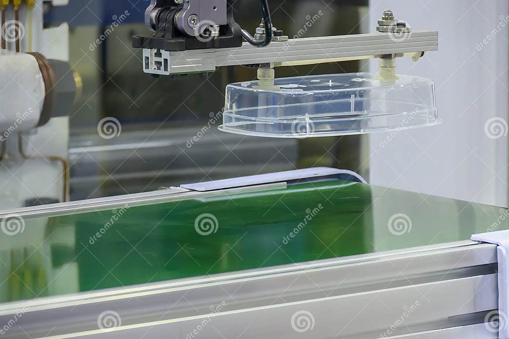 The Material Handling Process on Injection Machine Holding the Box Container Part by Robotic ...