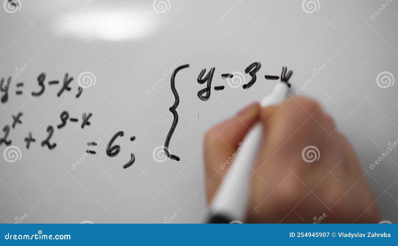 Young Student is Solving Math Equation on Whiteboard Close Up. Stock ...