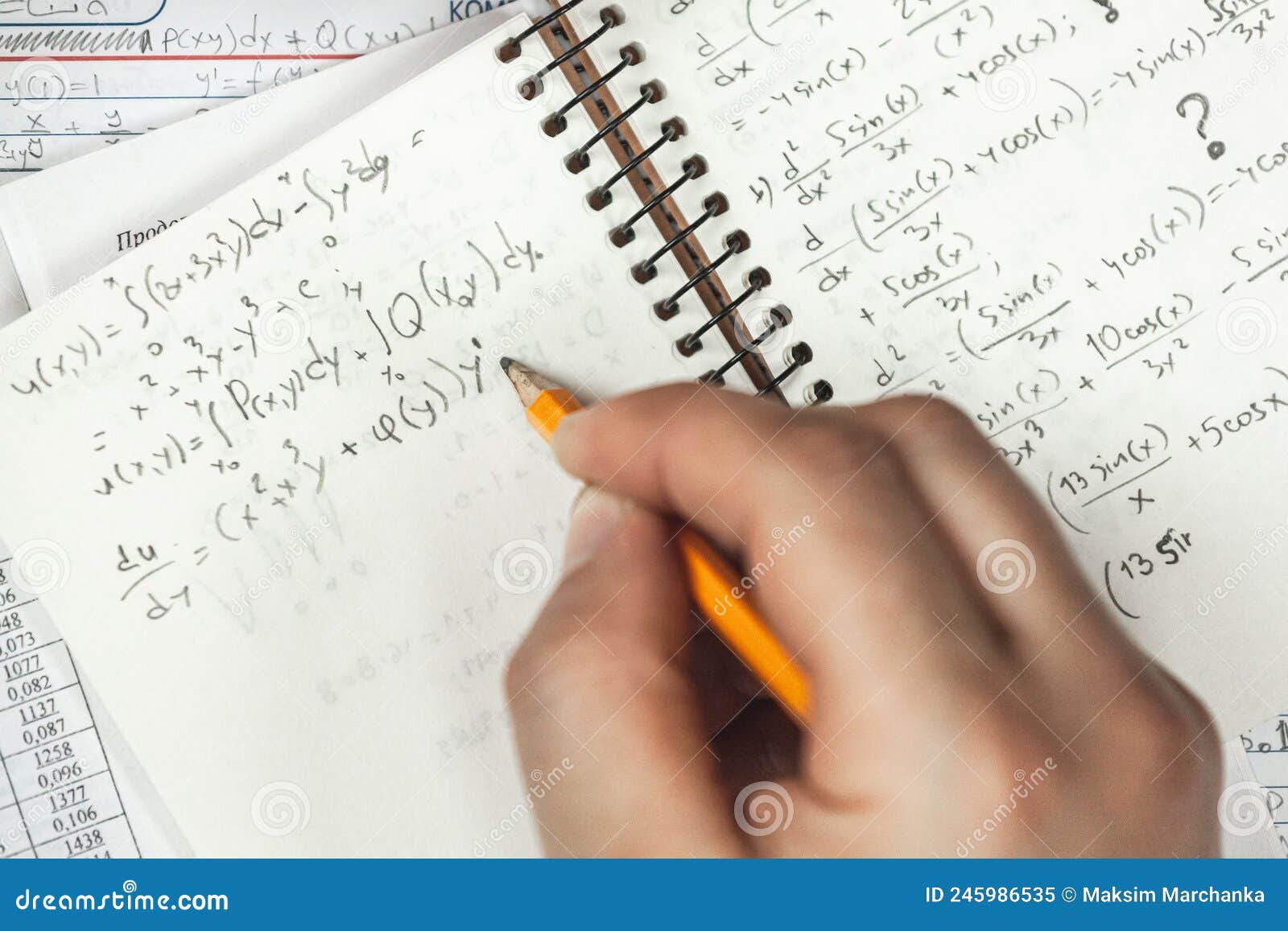Math Formulas are Written in Pencil in a Notebook Holding Man in Stock ...