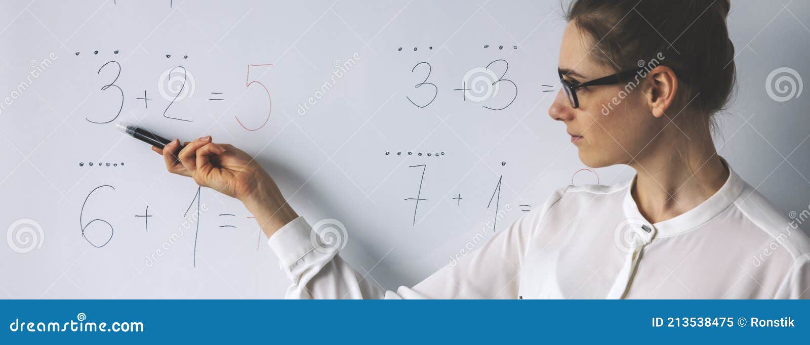 Math Lesson - Teacher Showing Simple Mathematical Equations on ...