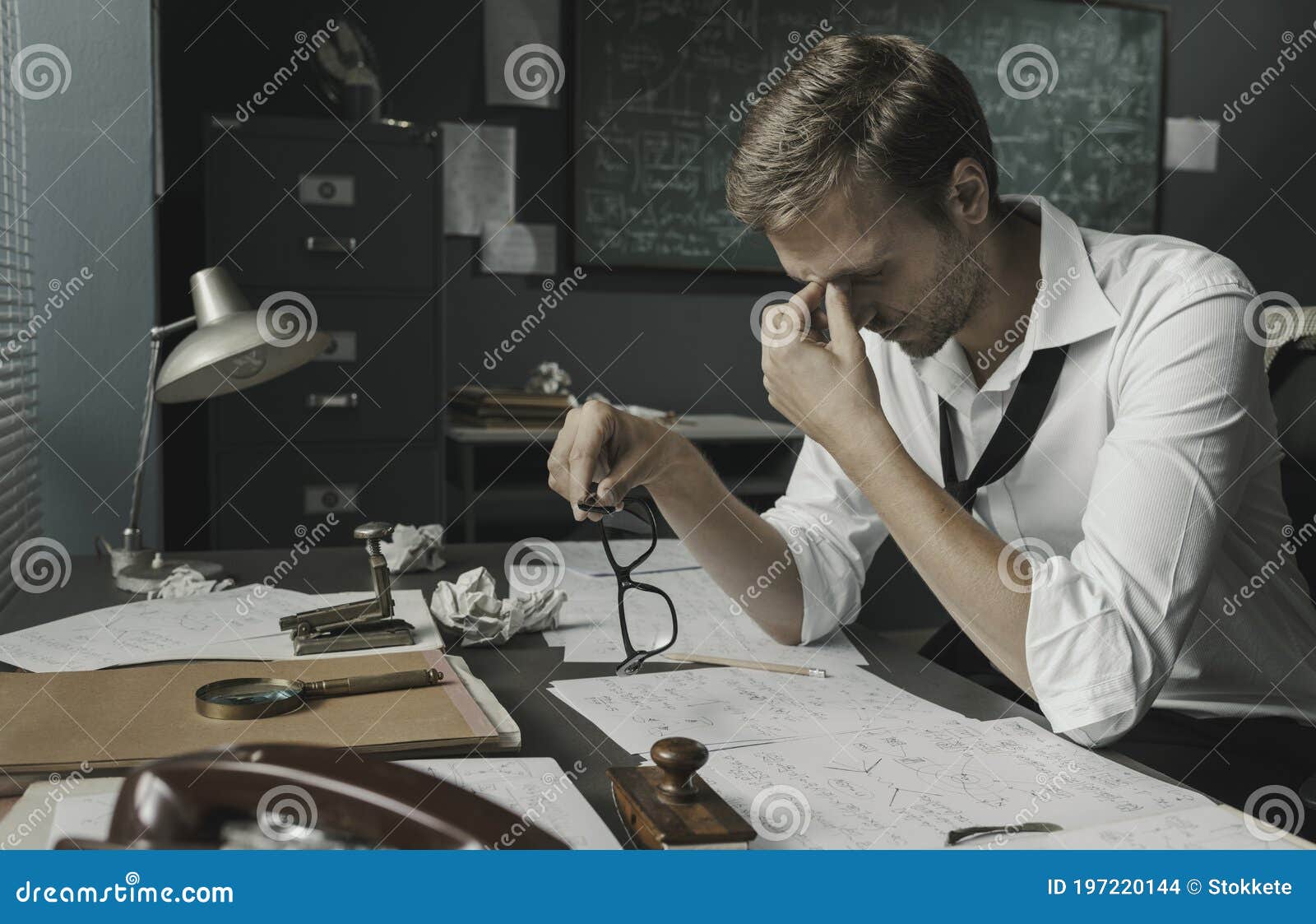 Math Student Sitting at Desk and Reviewing His Papers Stock Photo ...