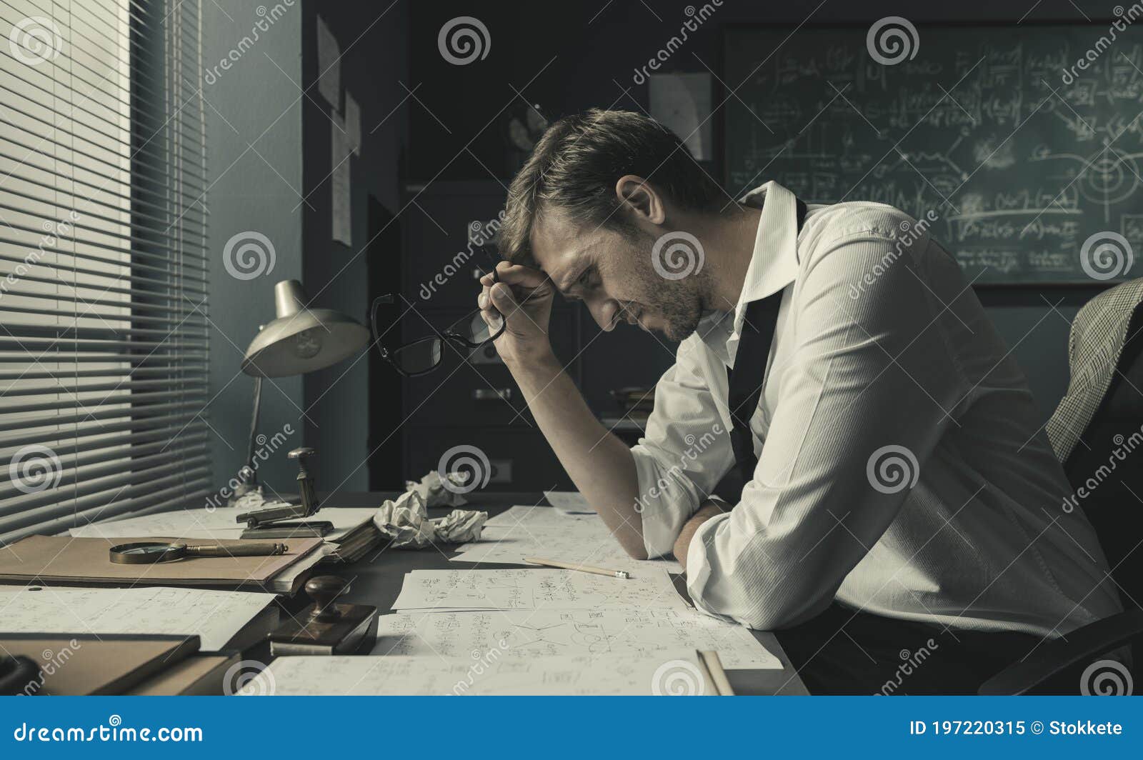 Math Student Sitting at Desk and Reviewing His Papers Stock Image ...