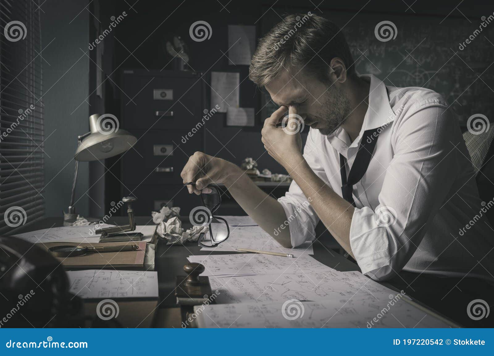 Math Student Sitting at Desk and Reviewing His Papers Stock Photo ...