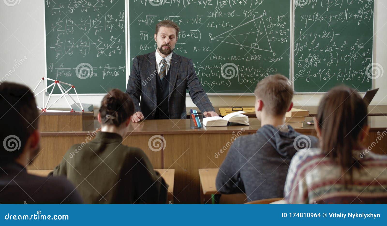 Math Teacher in Classroom with Pupils Stock Footage - Video of ...
