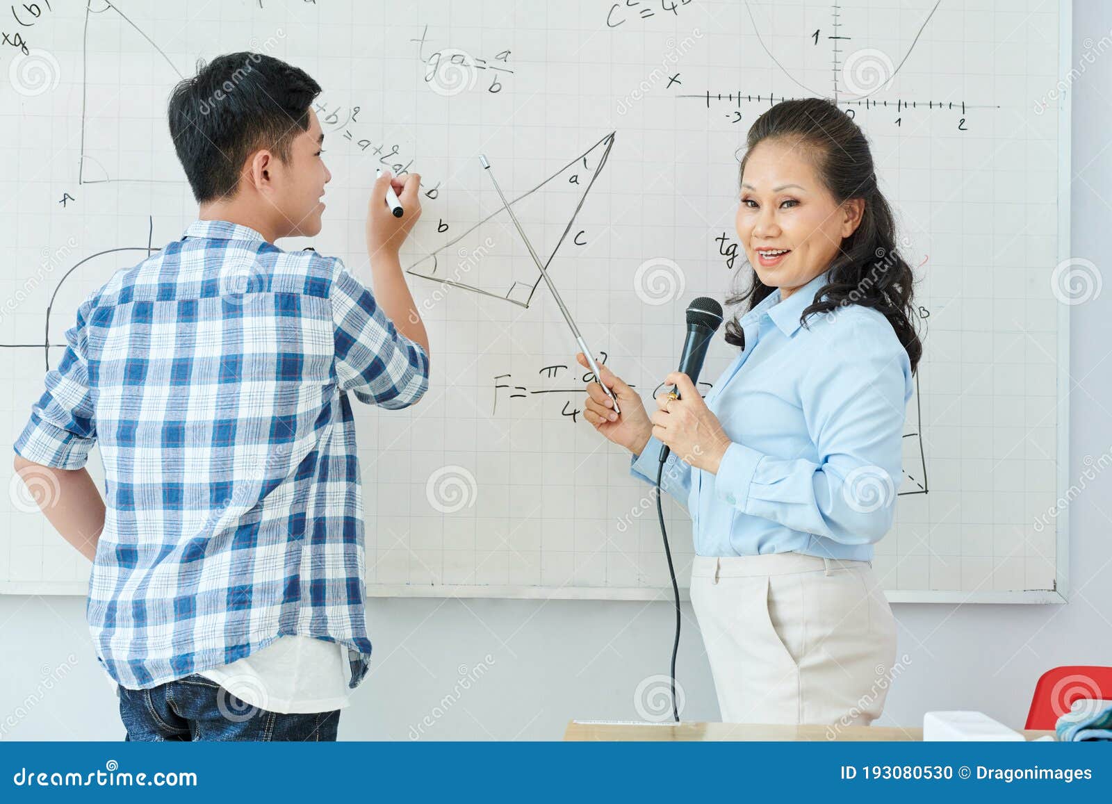 Math Teacher Explaining New Topic Stock Photo - Image of education ...