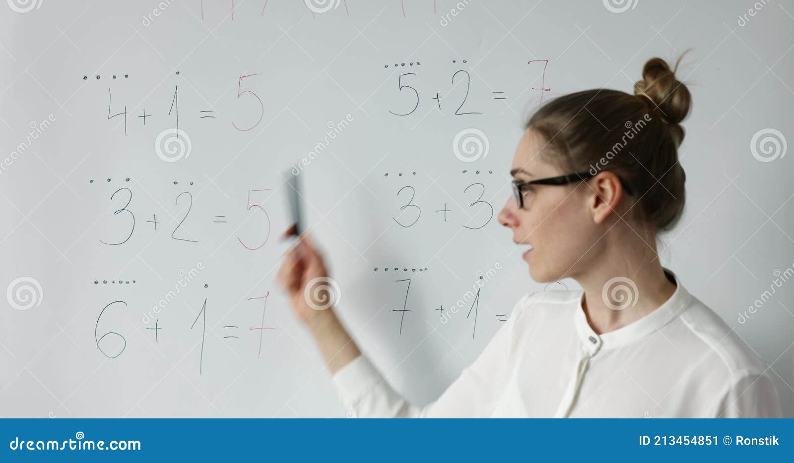 Math Teacher Explaining Primary School Basic Mathematics on Whiteboard ...