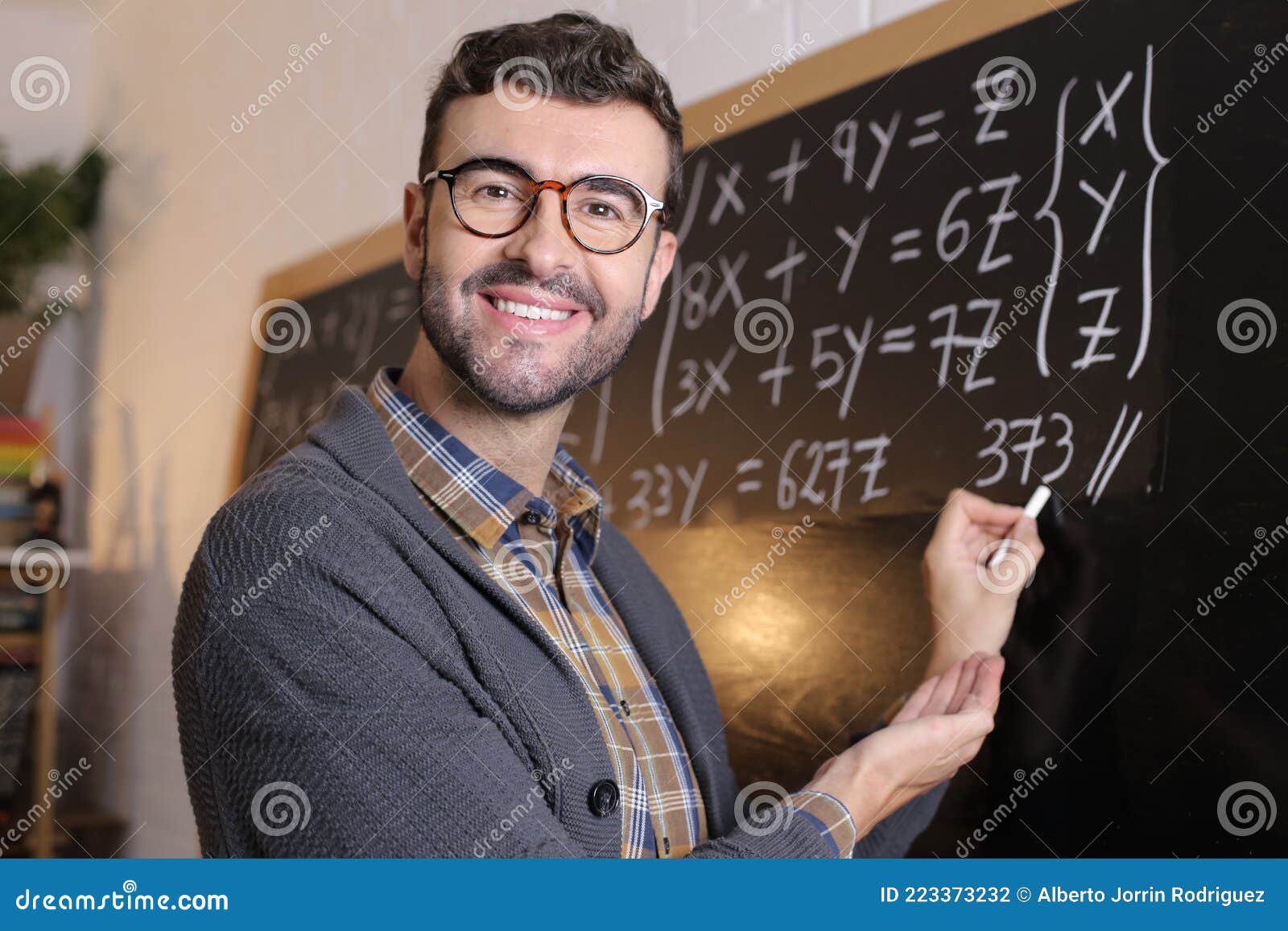 Math Teacher Writing with Chalk in Classroom Stock Photo - Image of ...