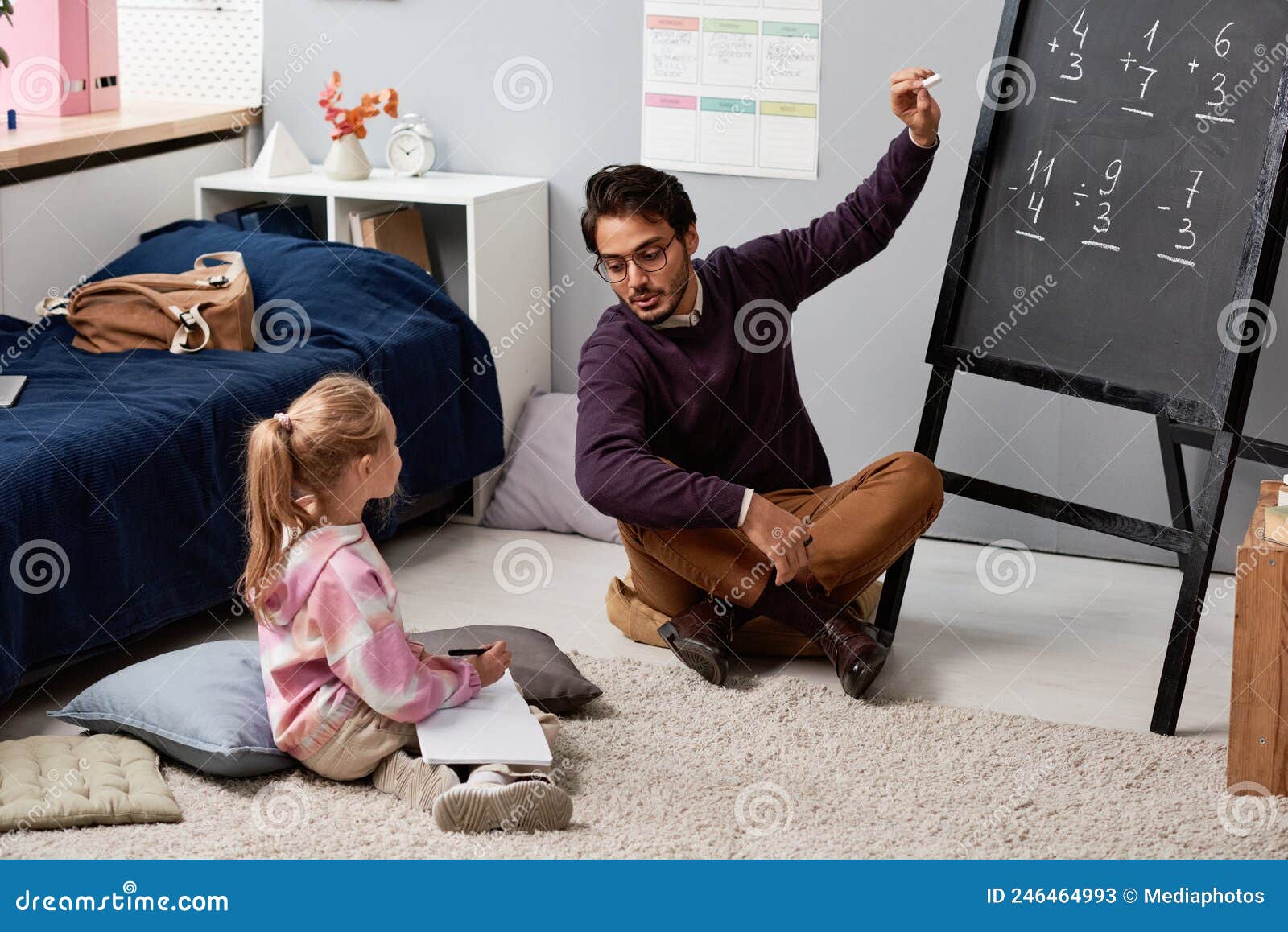 Math Tutor Explaining Rule To Girl Stock Image - Image of flooring ...
