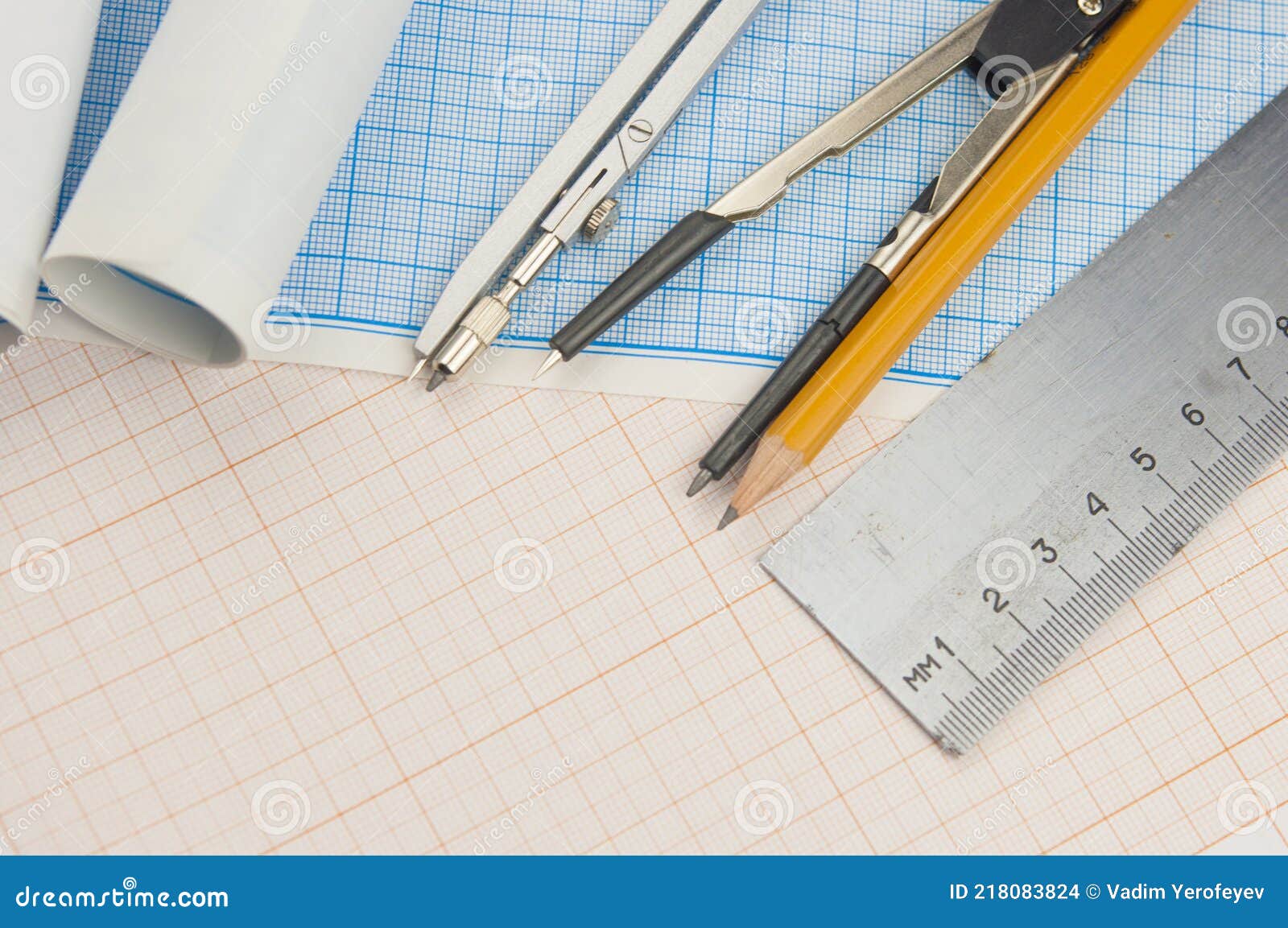 Mathematical Instruments Over the Corner of a Math Graph Paper with ...