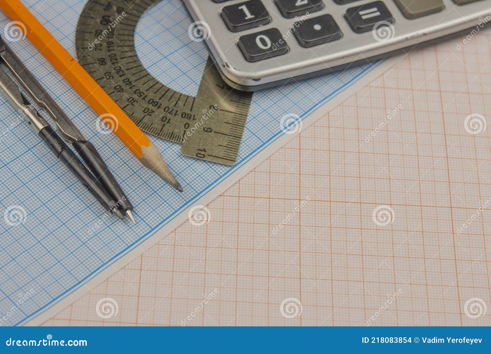 Mathematical Instruments Over the Corner of a Math Graph Paper with ...