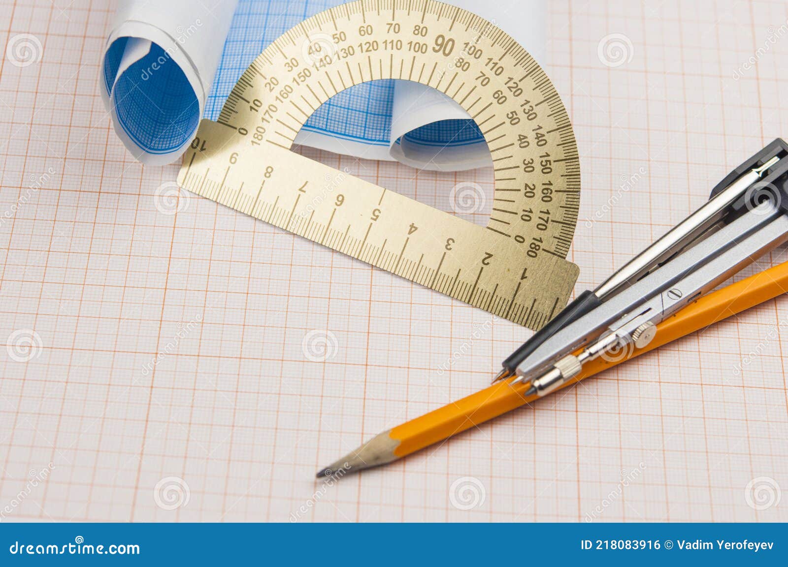 Mathematical Instruments Over the Corner of a Math Graph Paper with ...
