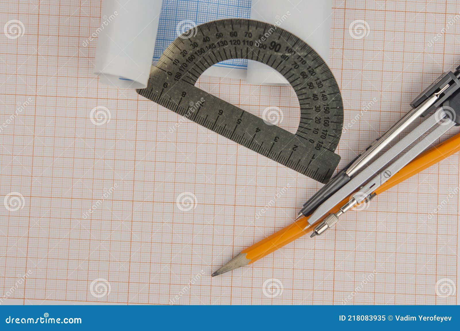 Mathematical Instruments Over the Corner of a Math Graph Paper with ...
