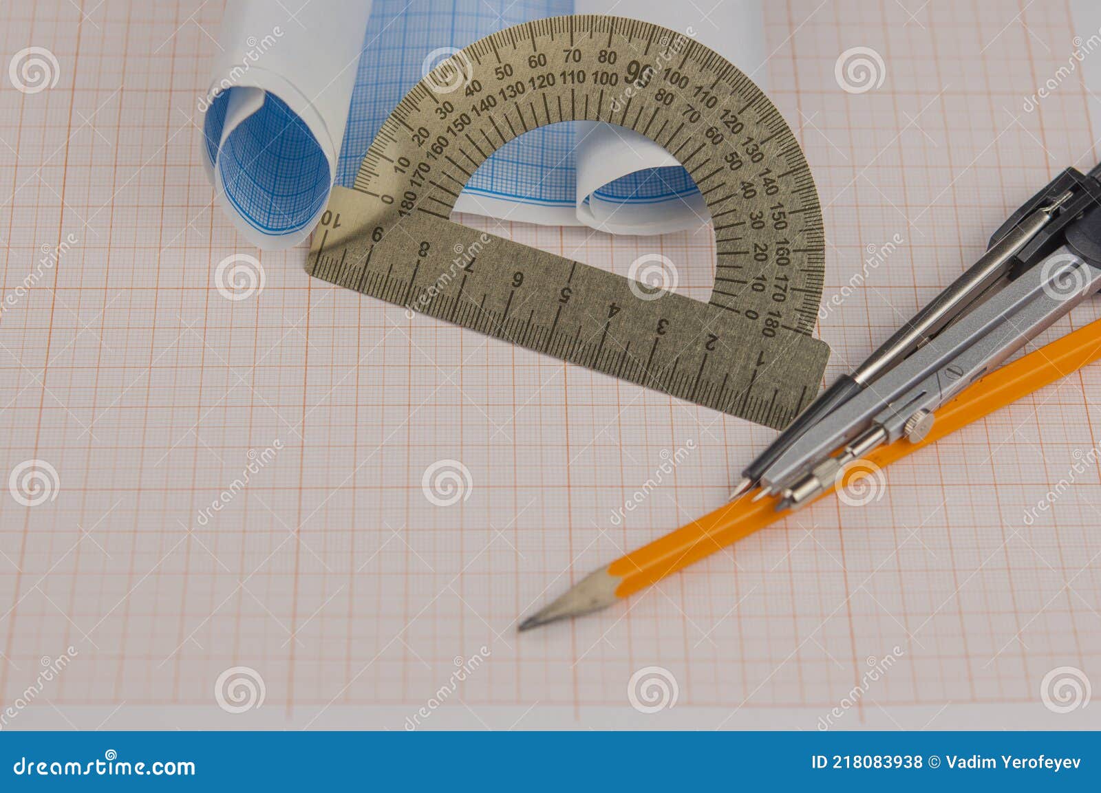Mathematical Instruments Over the Corner of a Math Graph Paper with ...