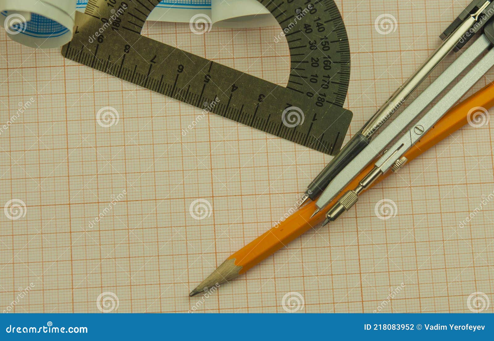 Mathematical Instruments Over the Corner of a Math Graph Paper with ...