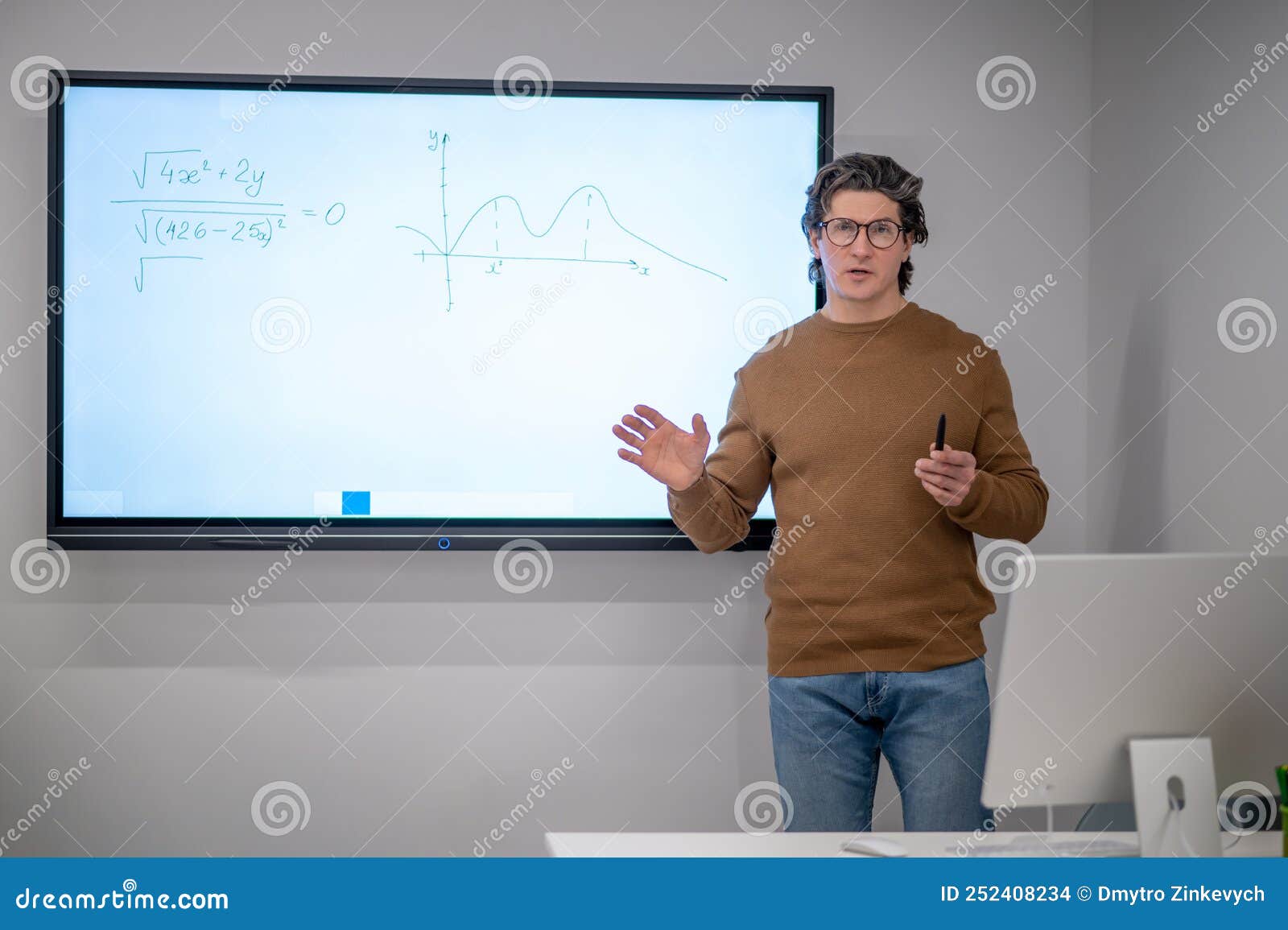 A School Teacher Explaining New Topic at Maths Lesson Stock Photo ...