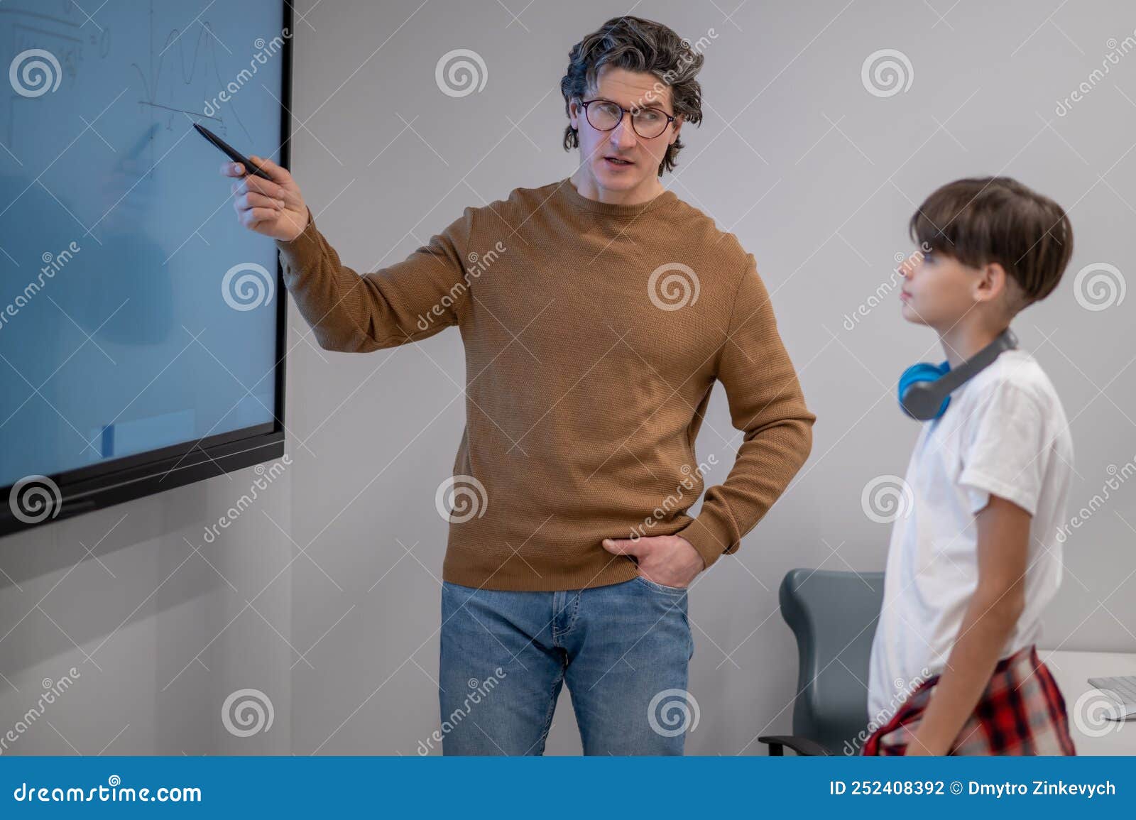 A School Teacher Explaining New Topic at Maths Lesson Stock Photo ...