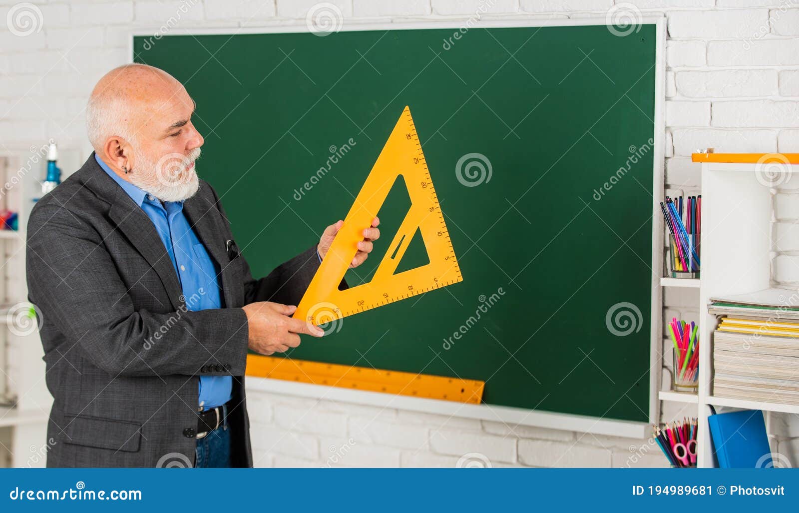 Maths Problem Solving. Senior Man Teacher Use Math Triangle Tool ...