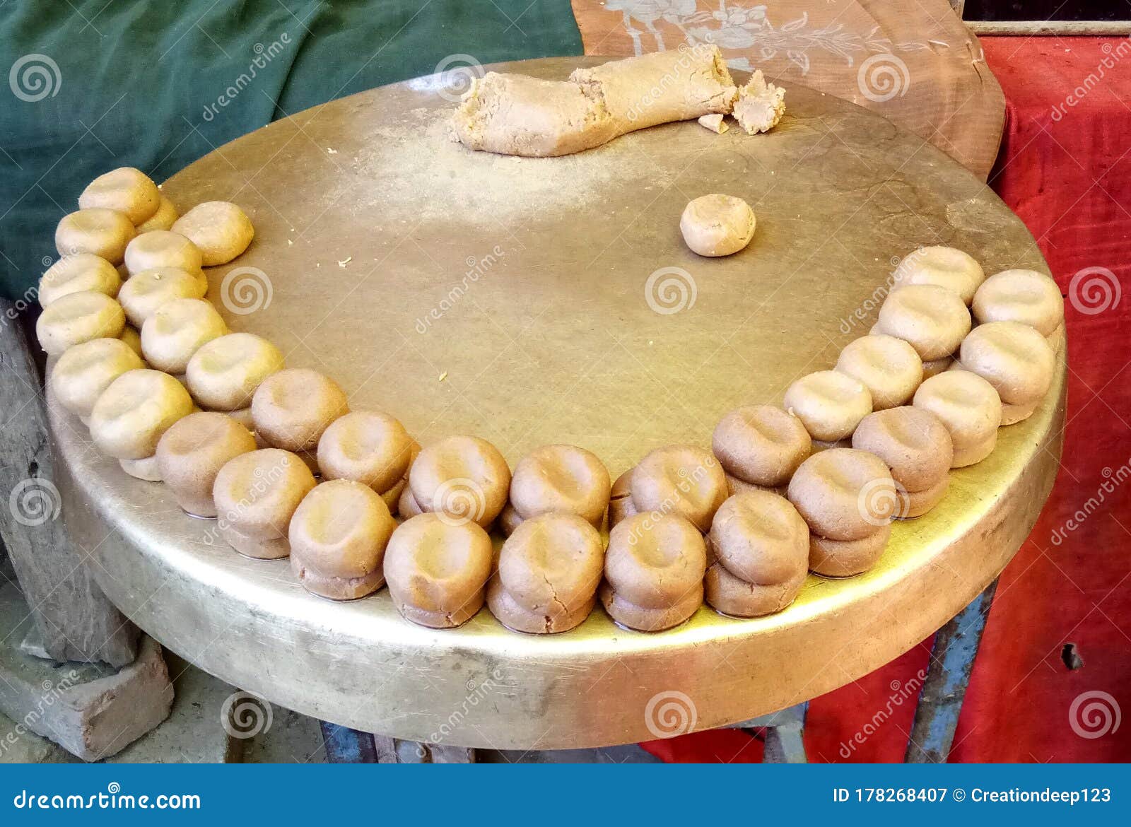 Mathura Ka Peda Is Served On A Clay Plate With Peacock Feather During ...