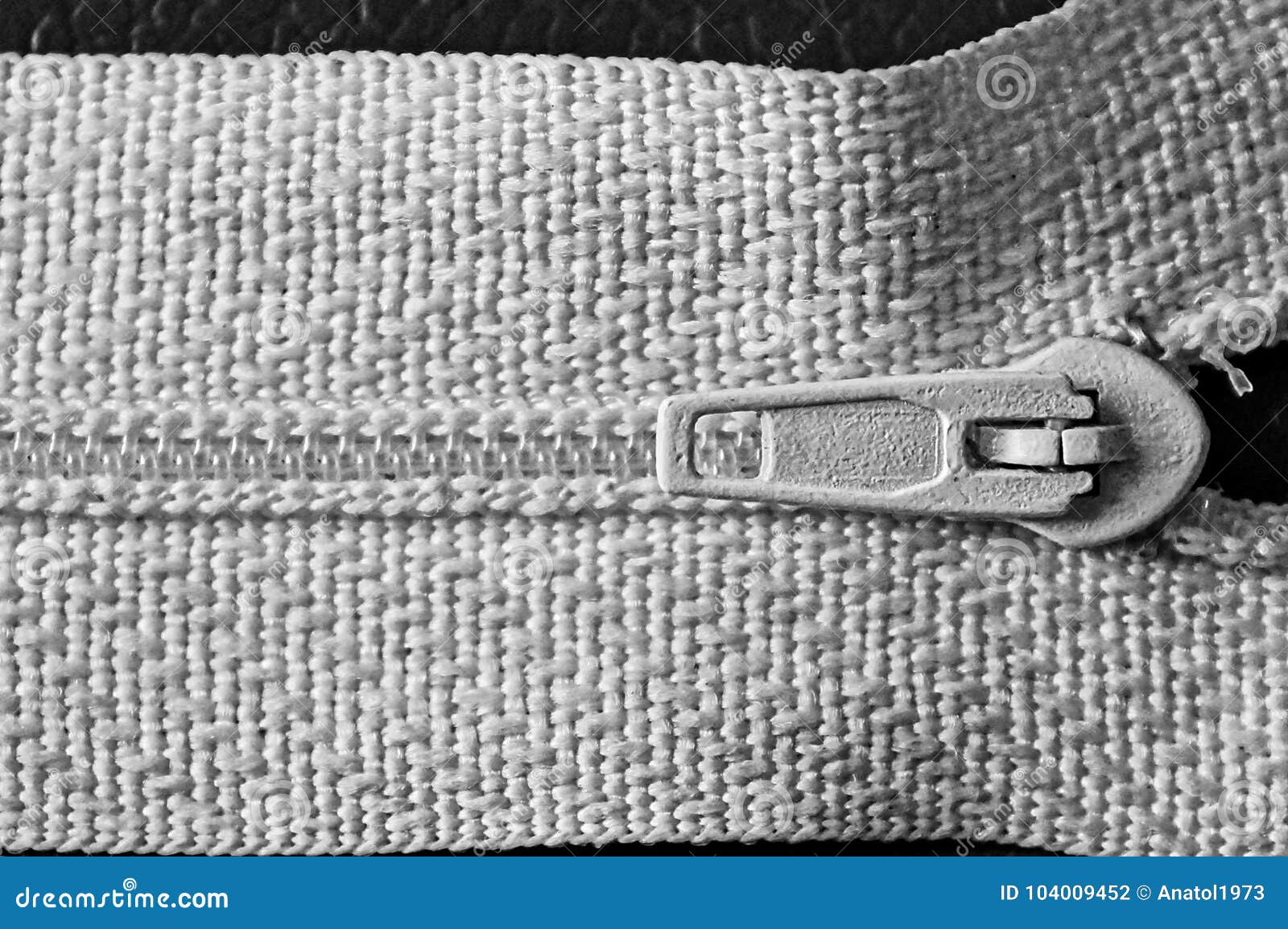 Part of a Zipper with a Lock on White Cloth Stock Photo - Image of ...
