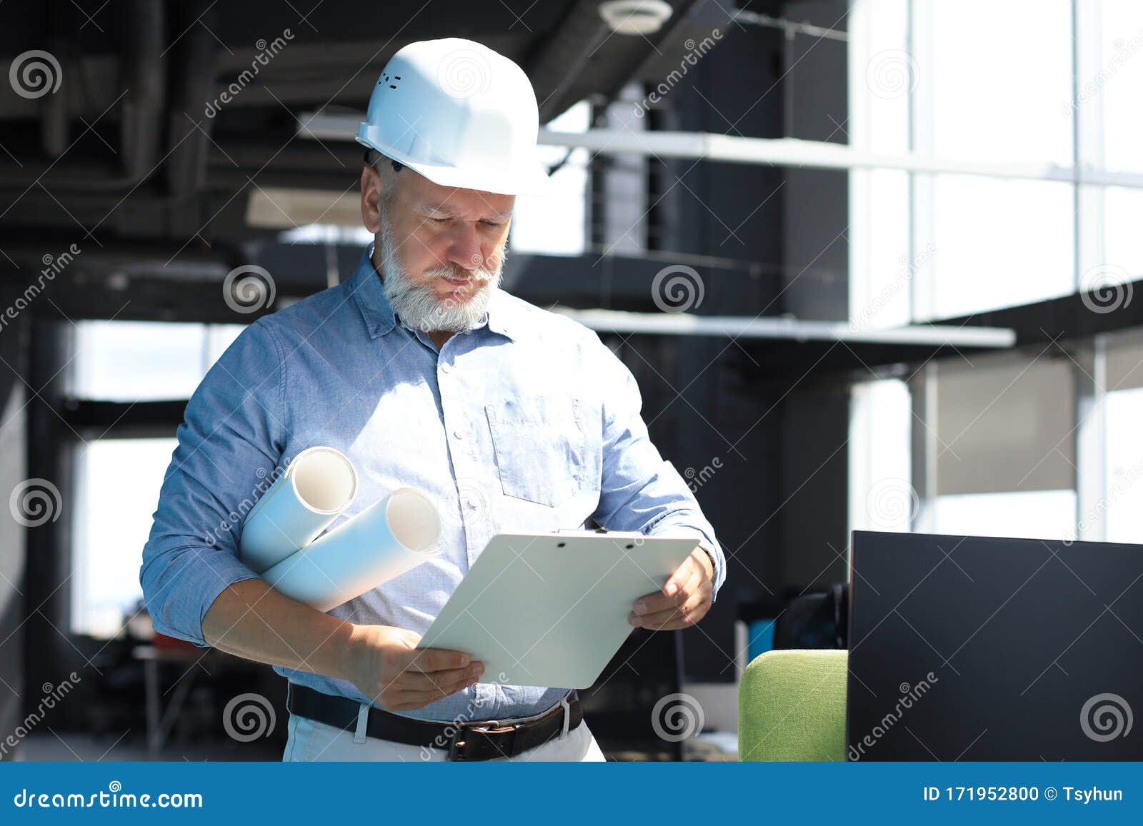 Mature Architect Wearing Hardhat Inspecting New Building Stock Photo ...