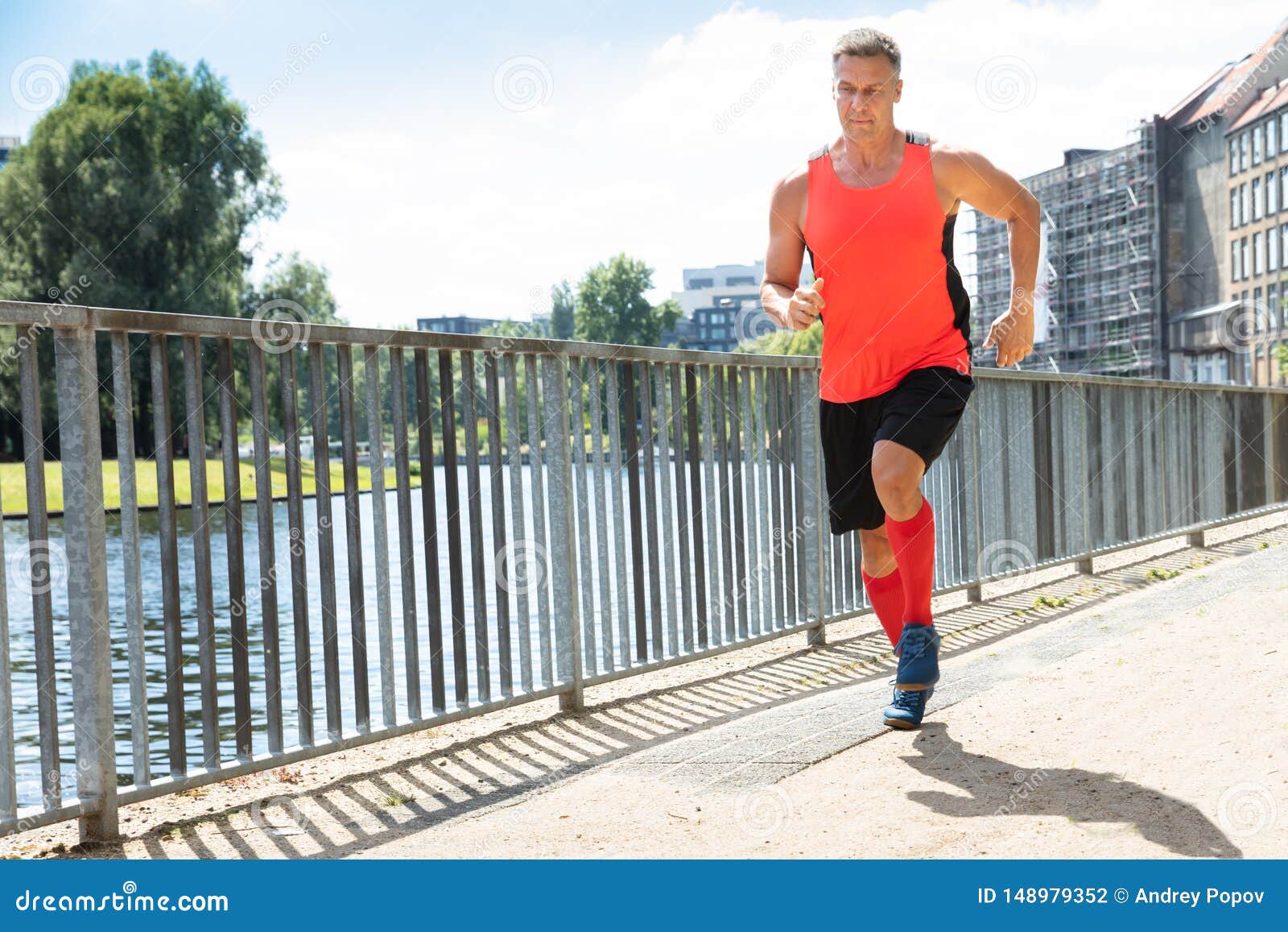Mature Athletic Man Running on Sidewalk Stock Photo - Image of nature ...