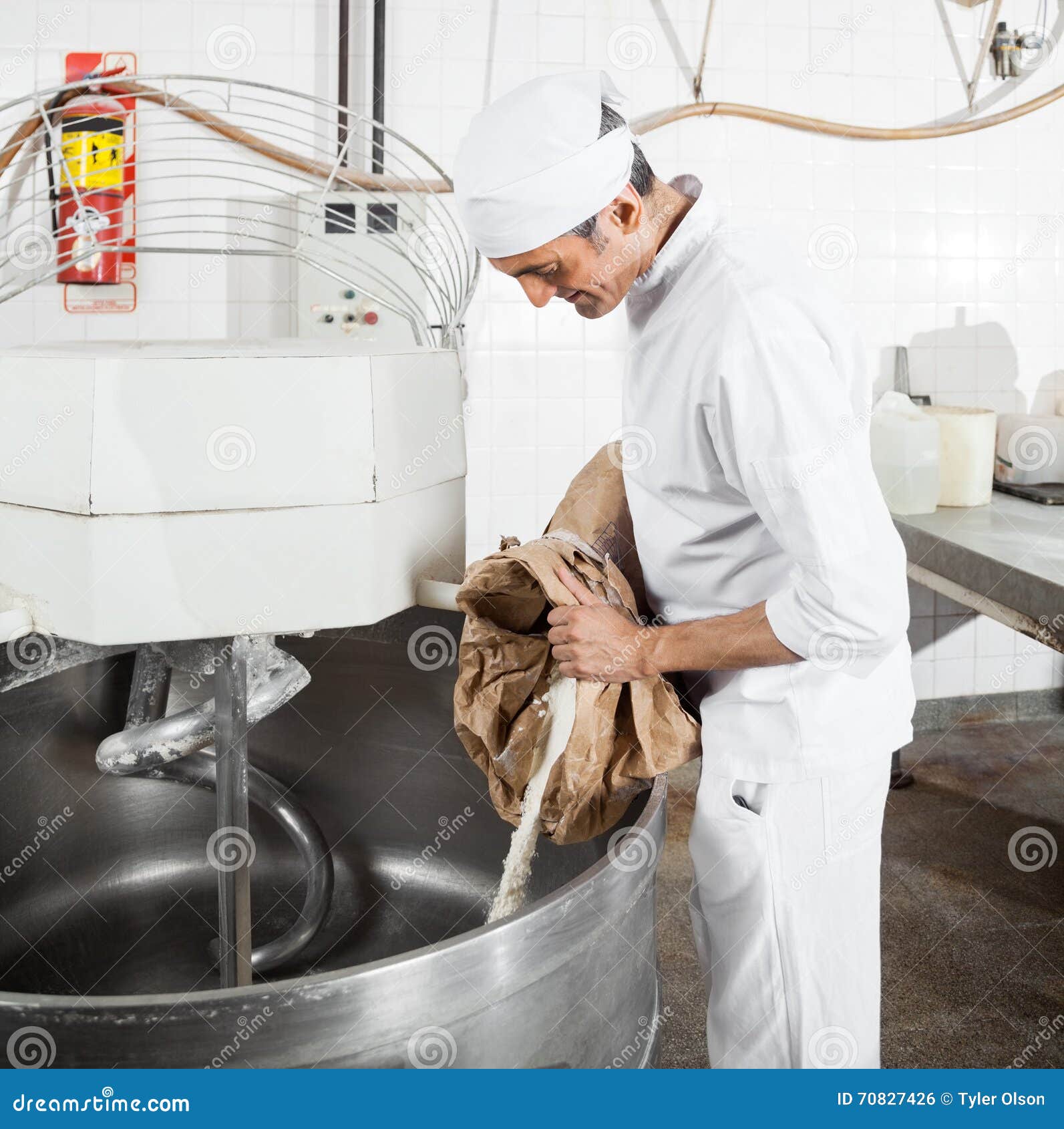Mature Baker Pouring Flour in Mixing Machine Stock Photo - Image of ...