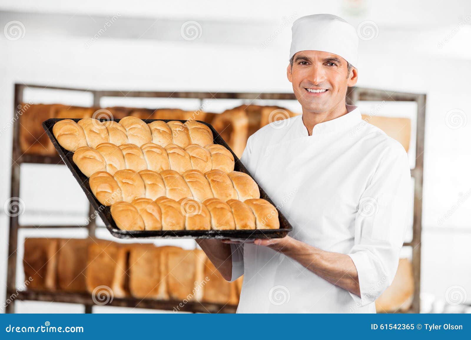 Mature Baker Showing Breads in Baking Tray Stock Image - Image of ...