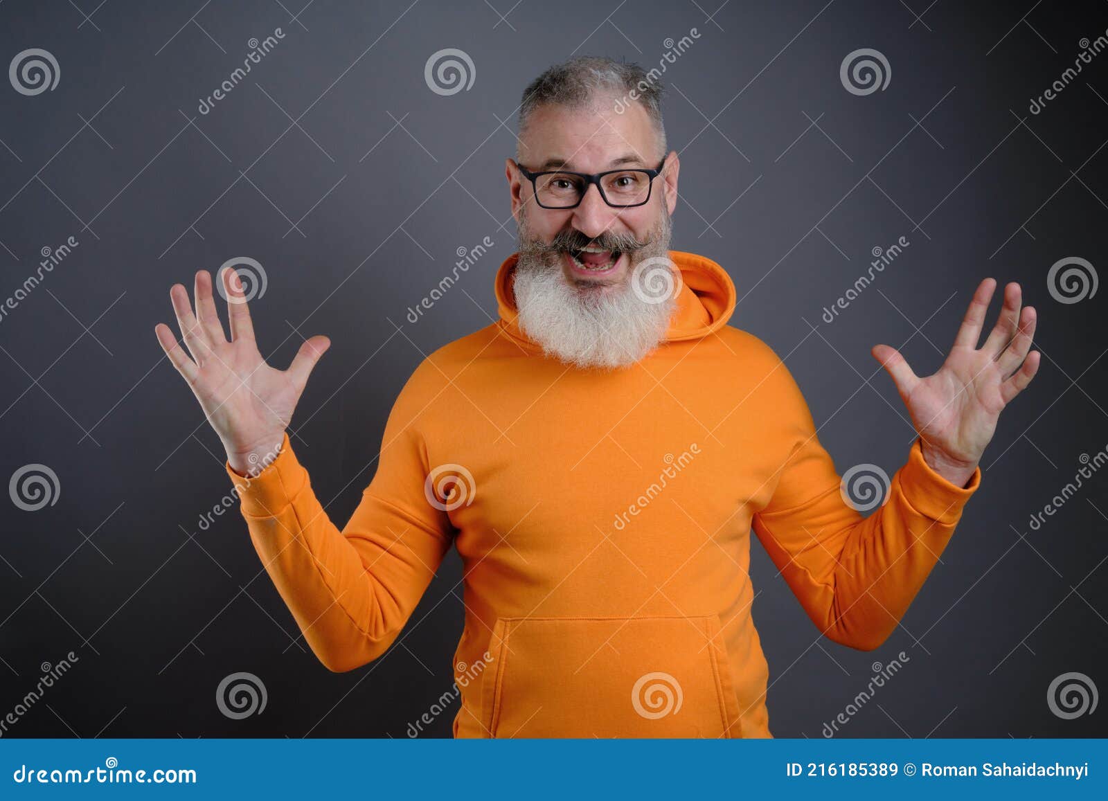 Mature Bearded Man In Eyeglasses Dressed Orange Hoodie Smiling And