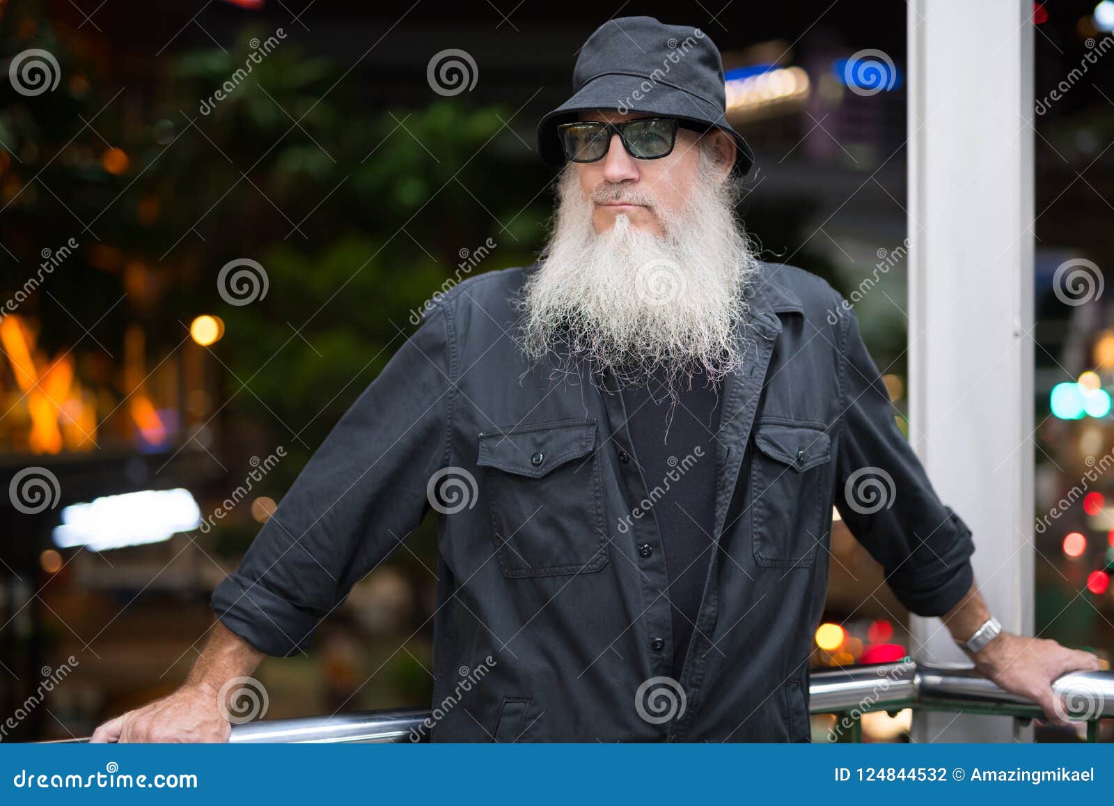Mature Bearded Tourist Man At Footbridge With View Of The City Stock
