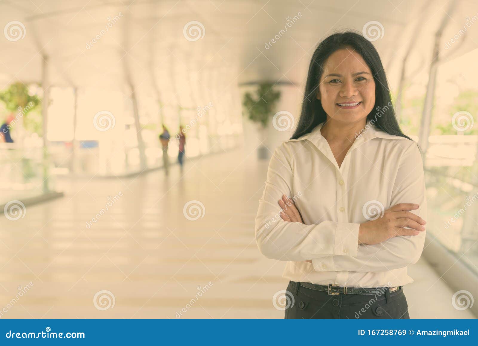 Mature Beautiful Asian Businesswoman Relaxing At The Footbridge In The