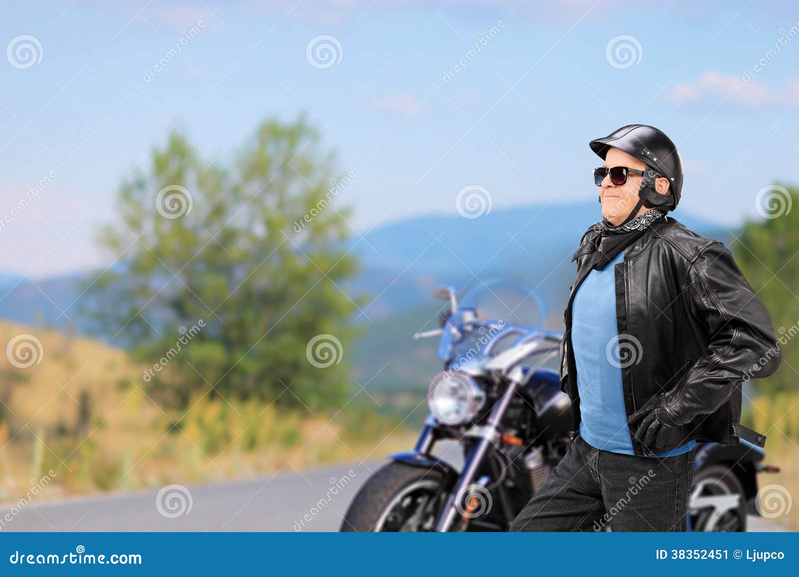 Mature Biker Walking in Front of His Motorbike Stock Image - Image of ...
