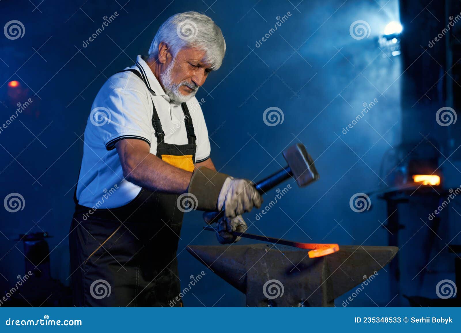 Mature Blacksmith Using Hammer for Work with Molten Steel Stock Image ...