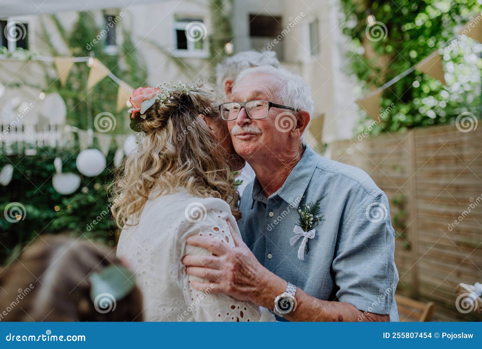 Mature Bride Receiving Congratulations at Wedding Reception Outside in ...