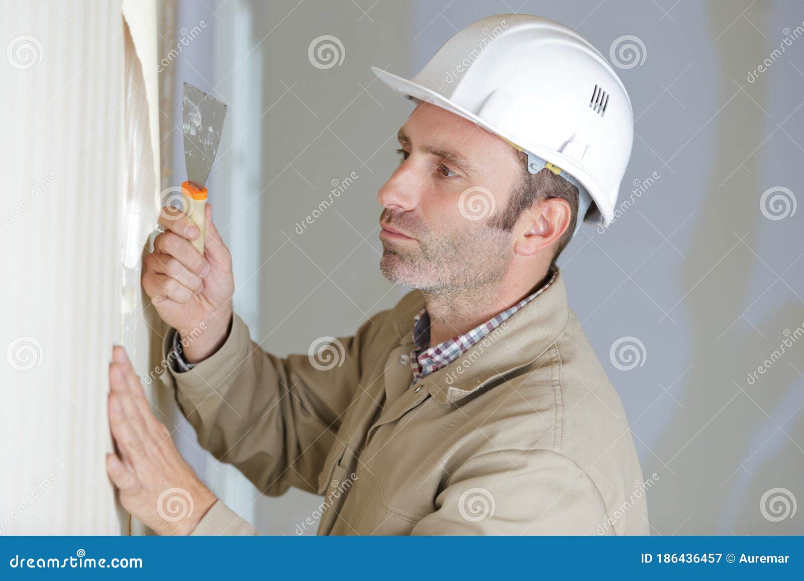 Mature Builder Using Scraper To Remove Old Wallpaper Stock Image ...