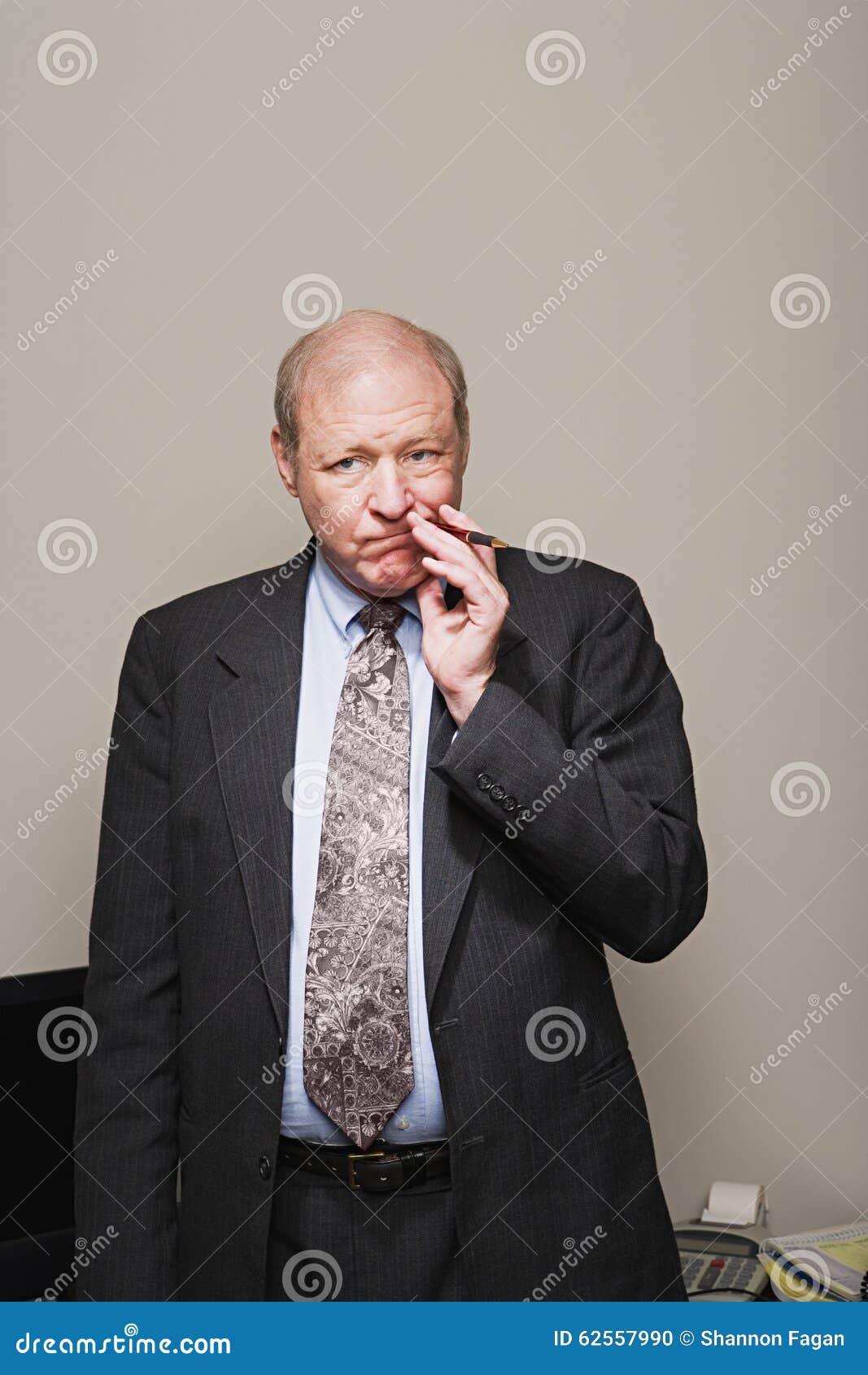 Mature Businessman Chewing His Pen Stock Photo - Image of business ...