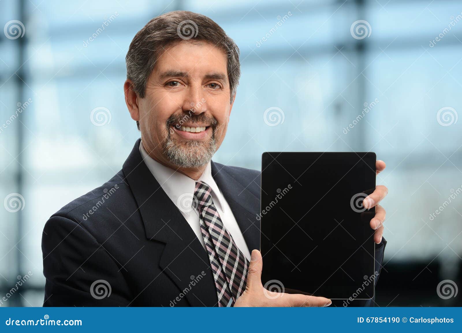 Mature Businessman Holding an Electronic Tablet Stock Photo - Image of ...