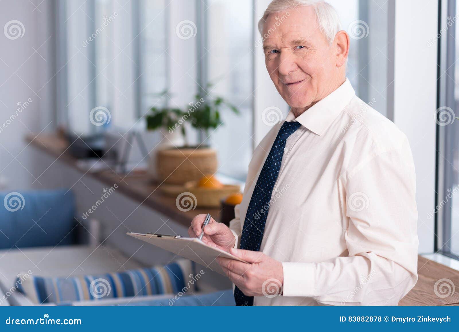 Mature Businessman Perusing a Document Stock Photo - Image of file ...