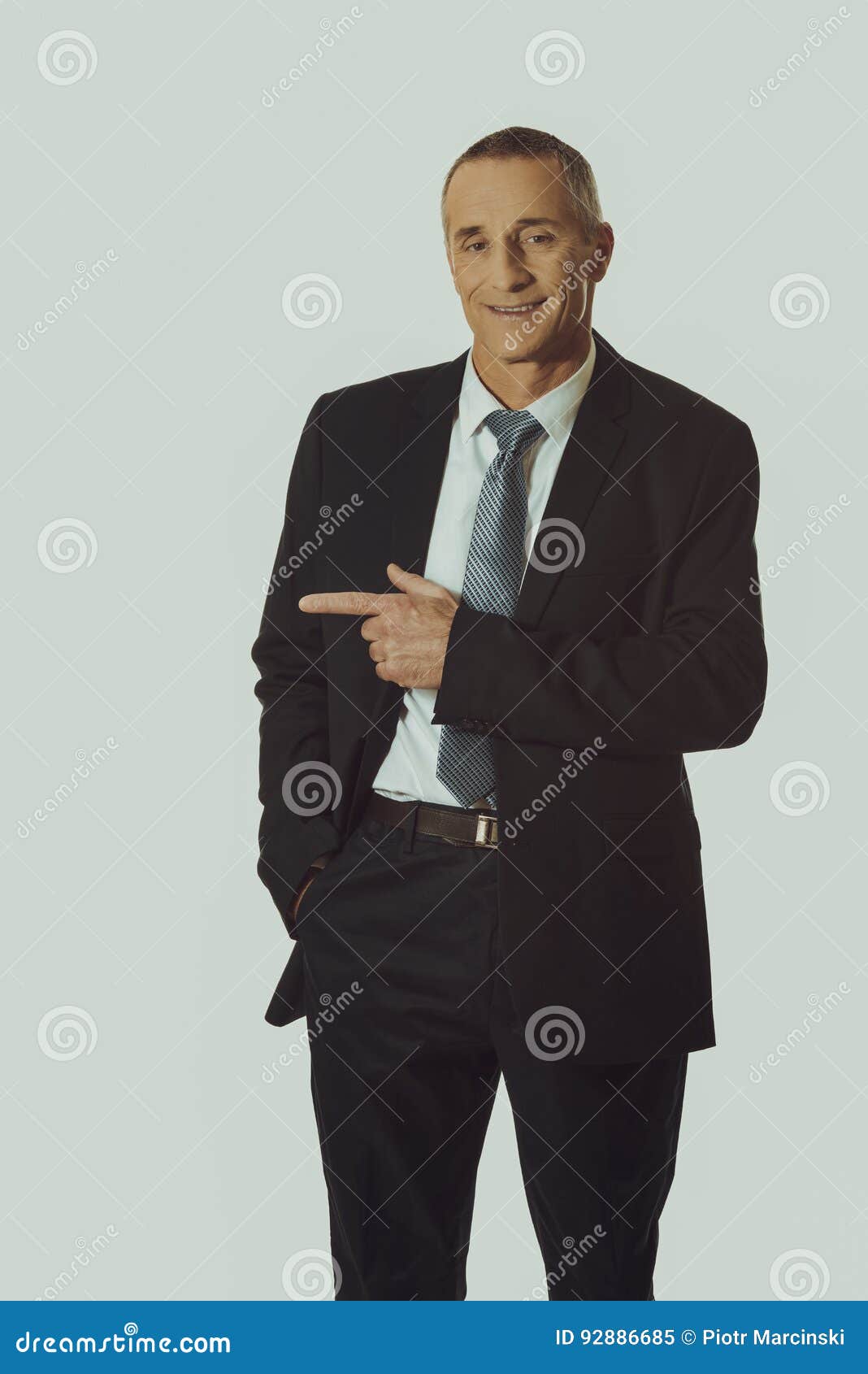 Mature Businessman Pointing To the Left Stock Image - Image of business ...