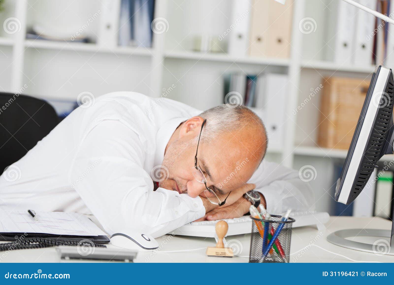 Mature Businessman Sleeping on Desk Stock Image - Image of overtime ...