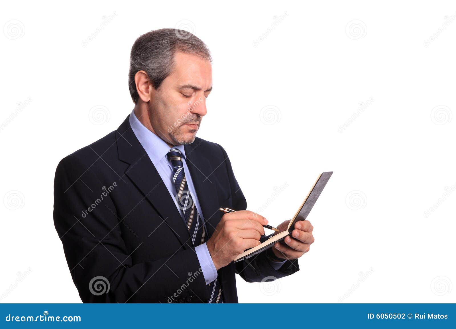 Mature Businessman Taking Notes Stock Photo - Image of caucasian ...