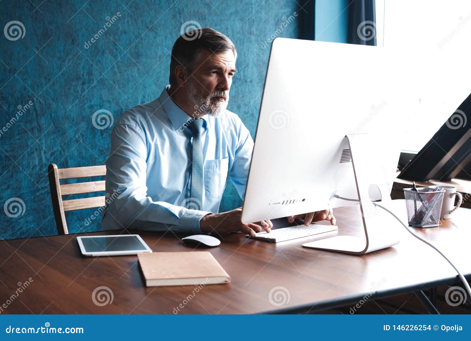 Mature Businessman Working on Computer in Office Stock Photo - Image of ...
