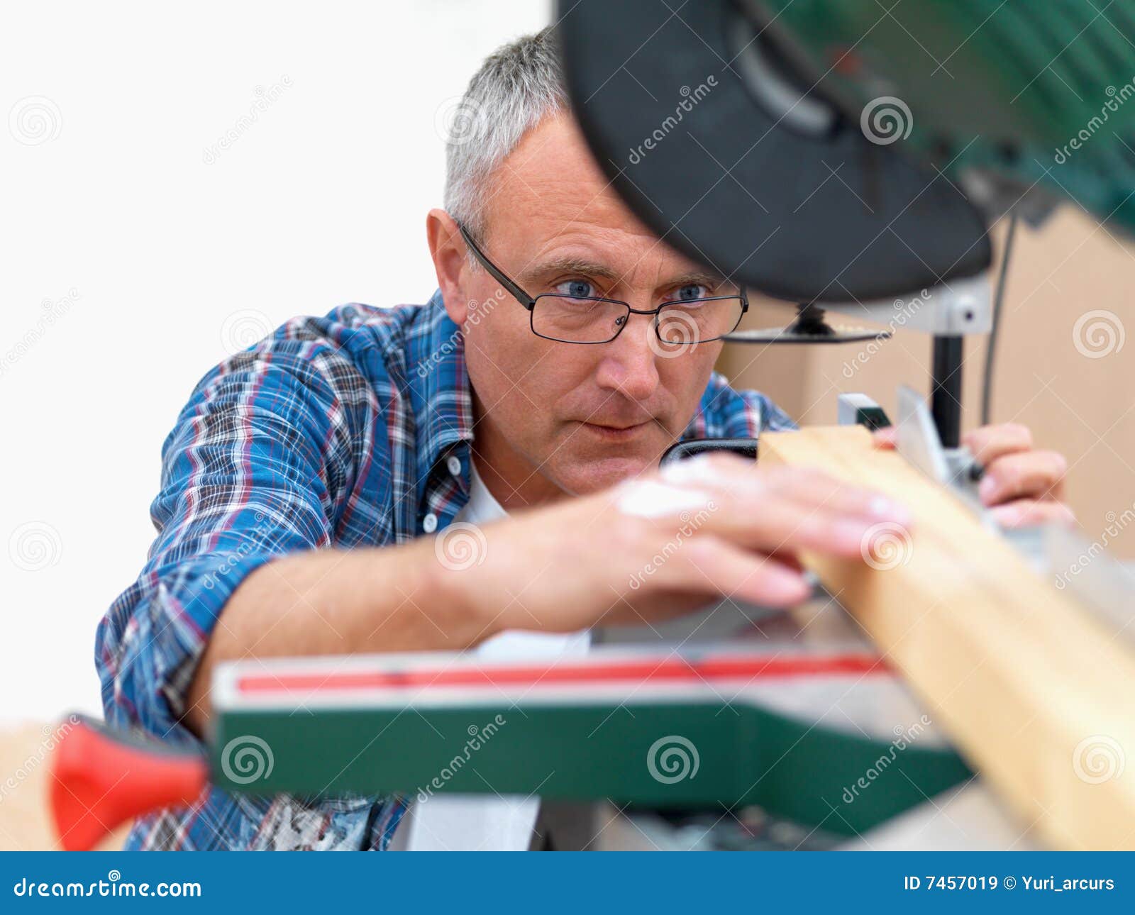 Mature Carpenter Lining Up a Cut for His Saw Stock Image - Image of ...