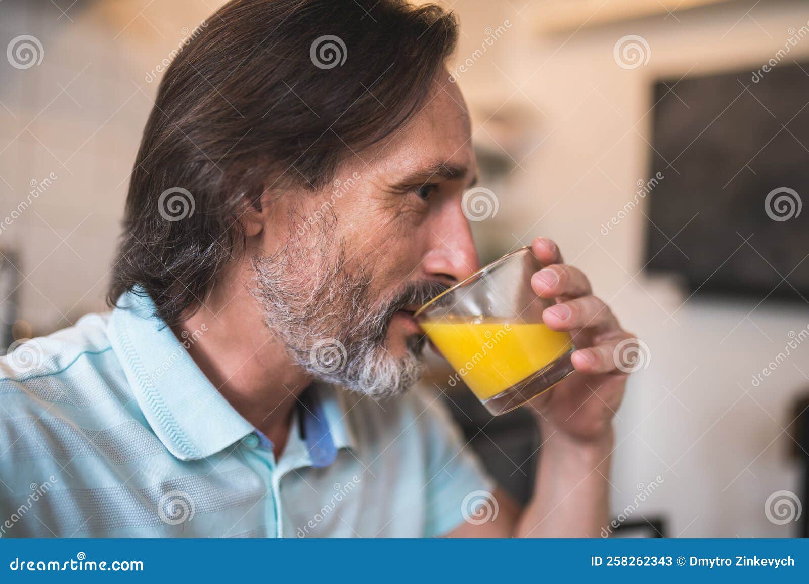 Mature Caucasian Man Sitting at the Table and Eating Breakfast Stock ...